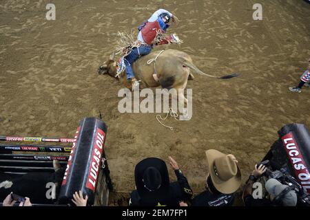 Professional bull rider Alisson de Souza from Brazil rides a bull named ...