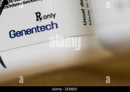 A Genentech logo is seen on prescription pharmaceutical packaging ...