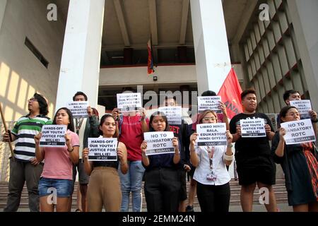 A Reserve Officers' Training Corps cadet scales a rope wall during a ...