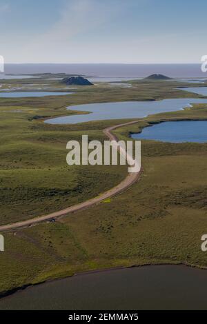 Aerial summer view of coastal Tuktoyaktuk surrounded by Arctic Ocean ...