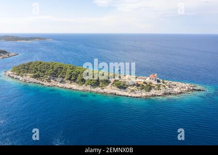 Aerial drone shot of Host Island in Adriatic sea near town port of Vis ...