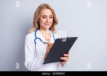 Photo of charming positive half turned girl beaming smile empty space ...