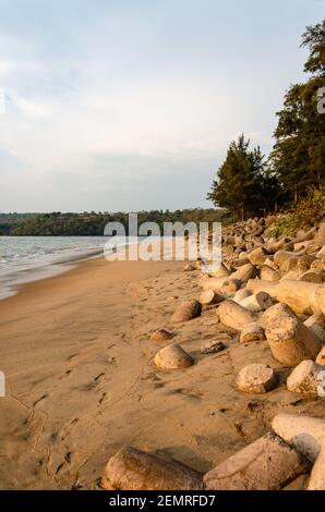 Querim Beach with tetra pods on the shore to prevent soil erosion. Querim or Keri Beach is ...