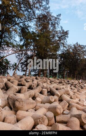 Querim Beach with tetra pods on the shore to prevent soil erosion. Querim or Keri Beach is ...