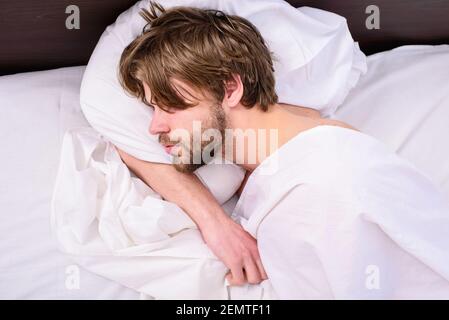 Man sleepy drowsy unshaven bearded face covered blanket having nap. Man ...