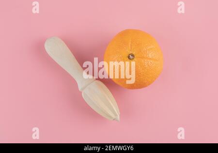 Fresh orange and wooden reamer on marble background Stock Photo - Alamy