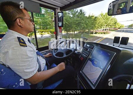 A Smart Panda Bus autonomous vehicle developed by DeepBlue Technology ...