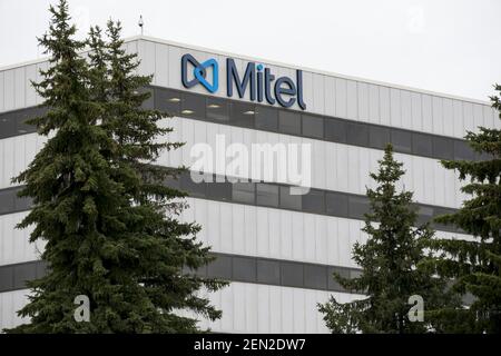 A logo sign outside of the headquarters of the Mitel Networks ...