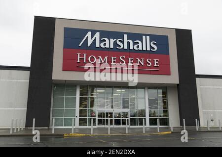 A logo sign outside of a Marshalls and HomeSense retail store location ...