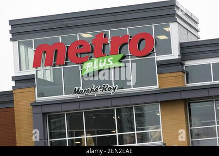 A logo sign outside of a Metro Plus retail grocery store location in ...