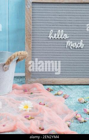 Hello march poster with pink scarf and flower blossoms around Stock ...