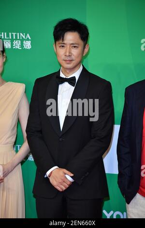 Chinese actor Gao Xin arrives on the red carpet for the 25th Shanghai ...