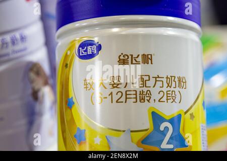 --FILE--Tins of Firmus milk powder of Feihe Dairy are displayed during ...