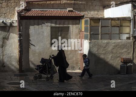 Jerusalem,Israel. An Ultra-Orthodox("Charedi") Jewish couple watch the ...