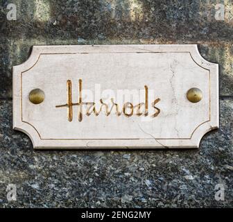 A name plate of Harrods by the entrance to the department store in ...
