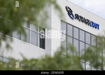 A logo sign outside of the headquarters of the Draper Laboratory in ...