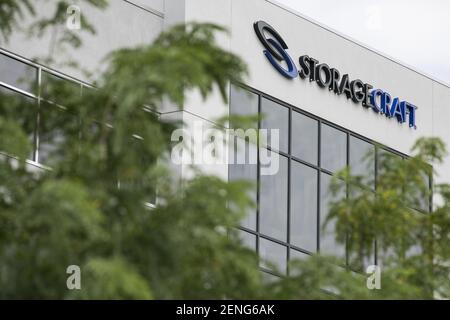 A logo sign outside of the headquarters of the Draper Laboratory in ...