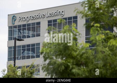 A logo sign outside of the headquarters of Progressive Leasing in ...