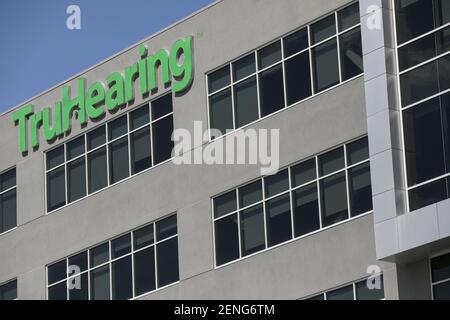 A logo sign outside of the headquarters of TruHearing in Draper, Utah ...