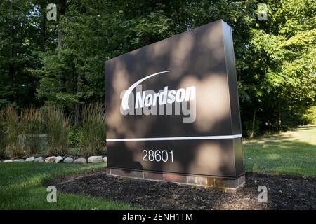 A logo sign outside of the headquarters of the Nordson Corporation in ...