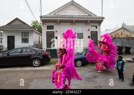 Black Masking Indians (Mardi Gras Indians), adorned in vibrant ...