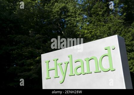 A logo sign outside of the headquarters of Hyland Software in Westlake ...