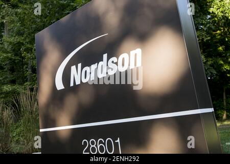 A logo sign outside of the headquarters of the Nordson Corporation in ...