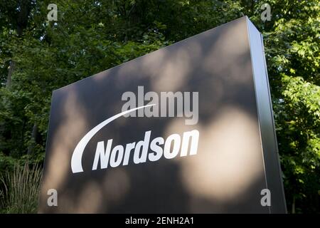 A logo sign outside of the headquarters of the Nordson Corporation in ...