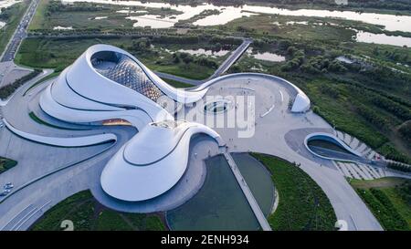 Aerial view of Harbin Opera House covered in snow, which is spectacular ...