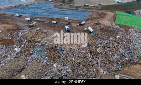 Chinese workers sort out and bury kitchen waste at the Tianziling ...