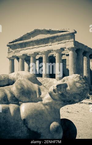 Bronze statue of fallen Icarus in front of Temple of Concordia in the ...