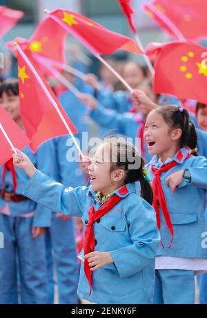 Students wearing uniforms of the Chinese Red Army dance during class ...