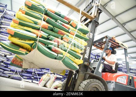A stack of sacks of crop fertilizer on farm for spreading Stock Photo ...