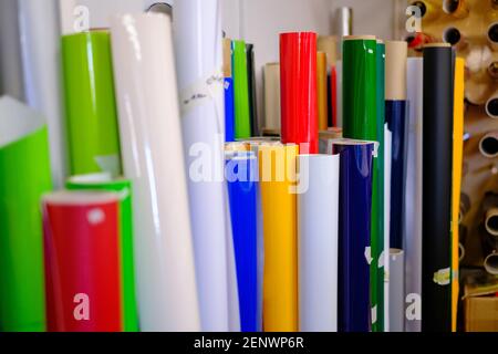 many colorful adhesive foils stand on the wall of a design studio Stock ...