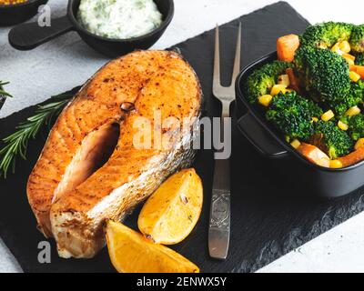 Baked salmon steak with broccoli Stock Photo - Alamy