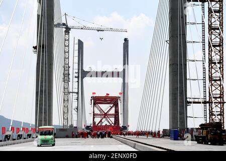 Chinese workers labor at the Pingtan Strait Road-rail Bridge, the world ...