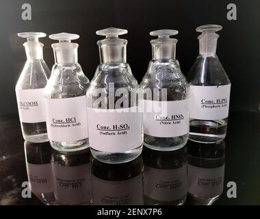 transparent bottles filled with concentrated acid Stock Photo - Alamy