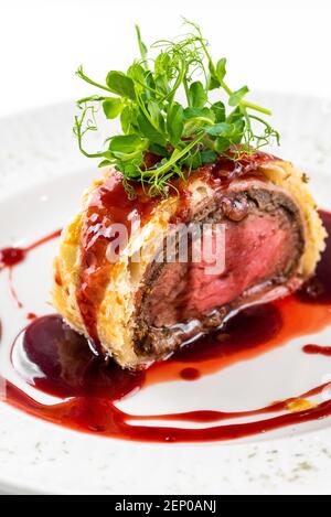Roasted Beef Wellington with gravy brown savory sauce, international ...