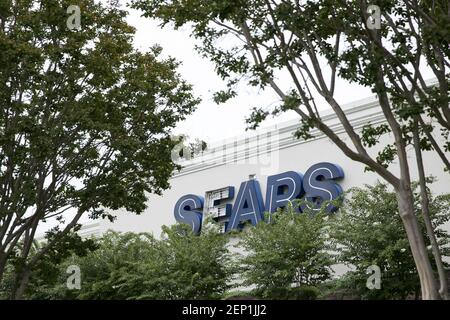 A logo sign outside of a closed Sears retail store location in Glen ...