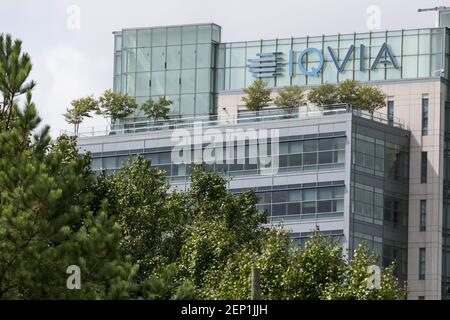 A logo sign outside of the headquarters of IQVIA in Durham, North ...