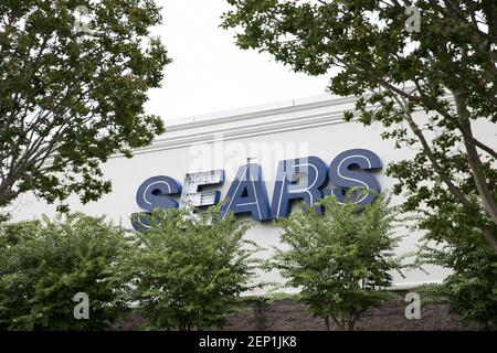 A logo sign outside of a closed Sears retail store location in Glen ...