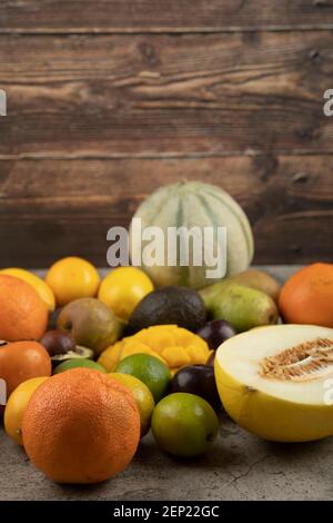 Composition of ripe delicious whole persimmon fruits, half and sliced ...