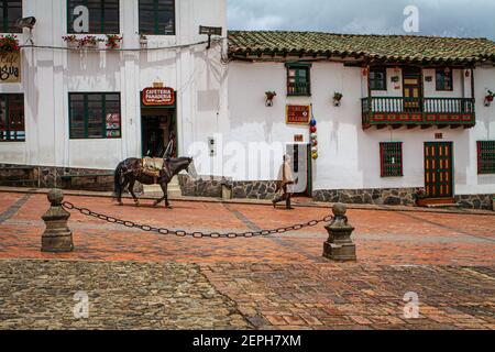 horse, with Colombian farmer traditional poncho, ruana, hat.500 year ...