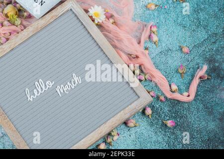 Hello march poster with pink scarf and flower blossoms around Stock ...