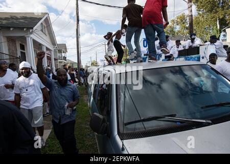 Kids dance atop a car during a vibrant second line parade in the Treme ...