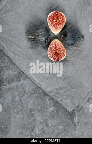 Top view of grey tablecloth for food on wooden background. Empty space ...