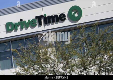 A logo sign outside of the headquarters of the DriveTime Automotive ...