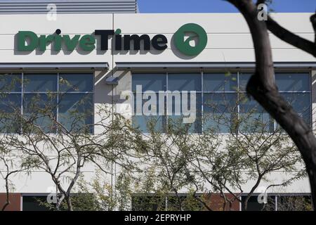 A logo sign outside of the headquarters of the DriveTime Automotive ...