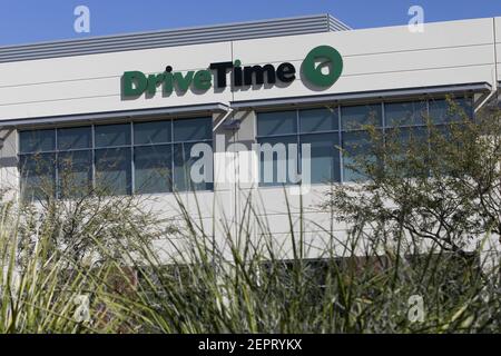 A logo sign outside of the headquarters of the DriveTime Automotive ...