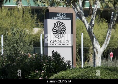 A logo sign outside of the headquarters of the Apollo Education Group ...